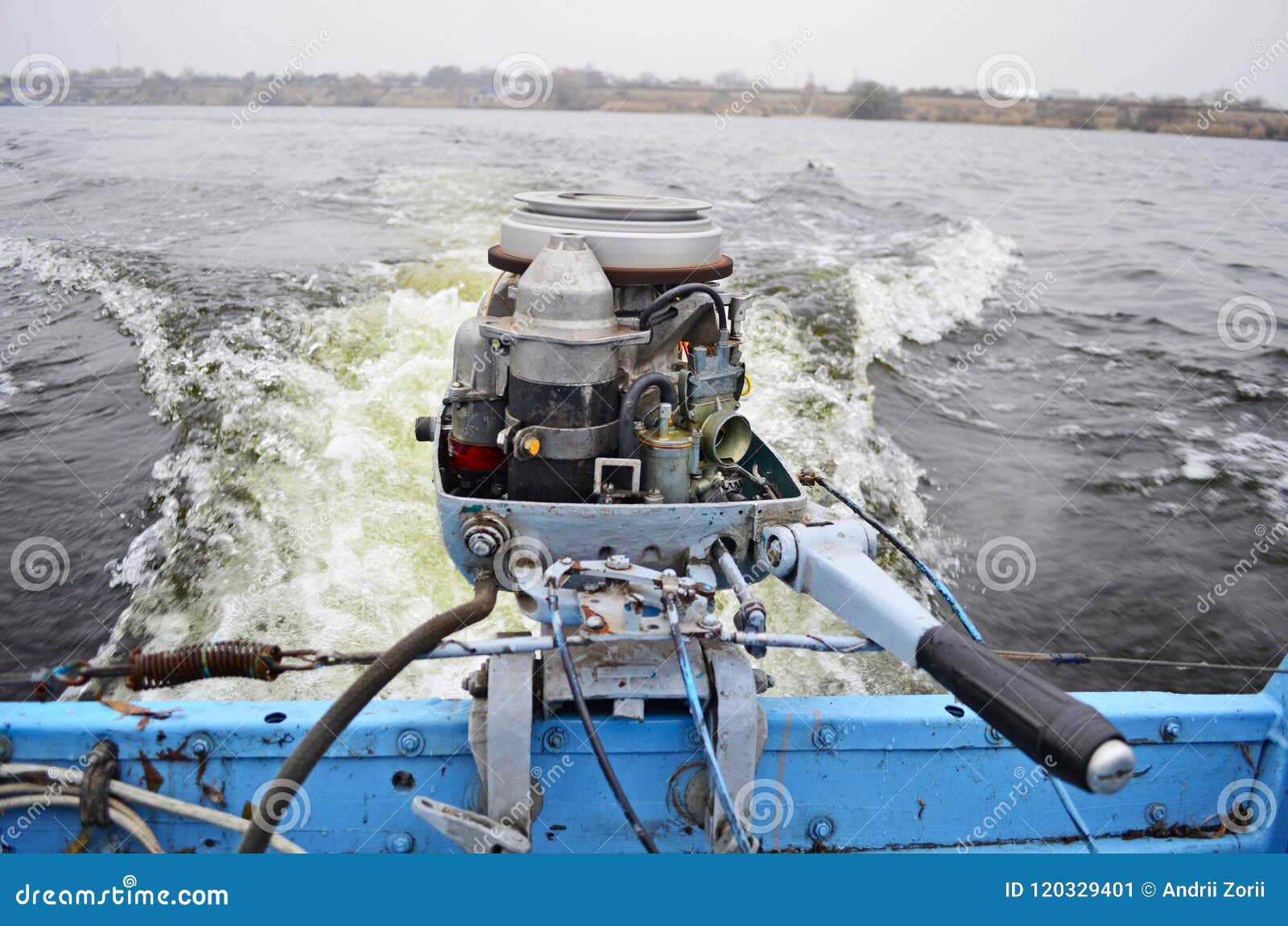 An Old Boat with a Running Old Motor Sails on the River. Stock Image ...