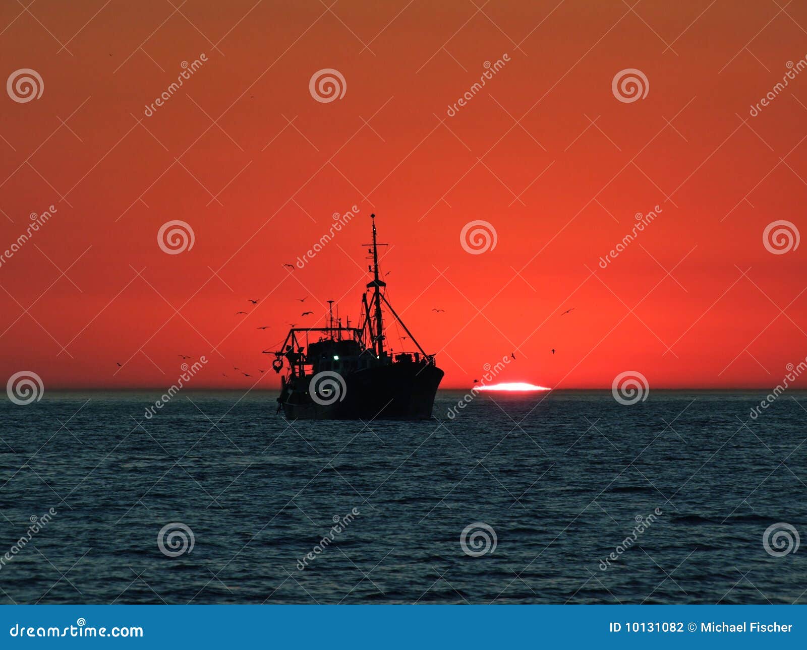 Boat in Front of a Sunset at the Horizon Stock Photo - Image of town ...