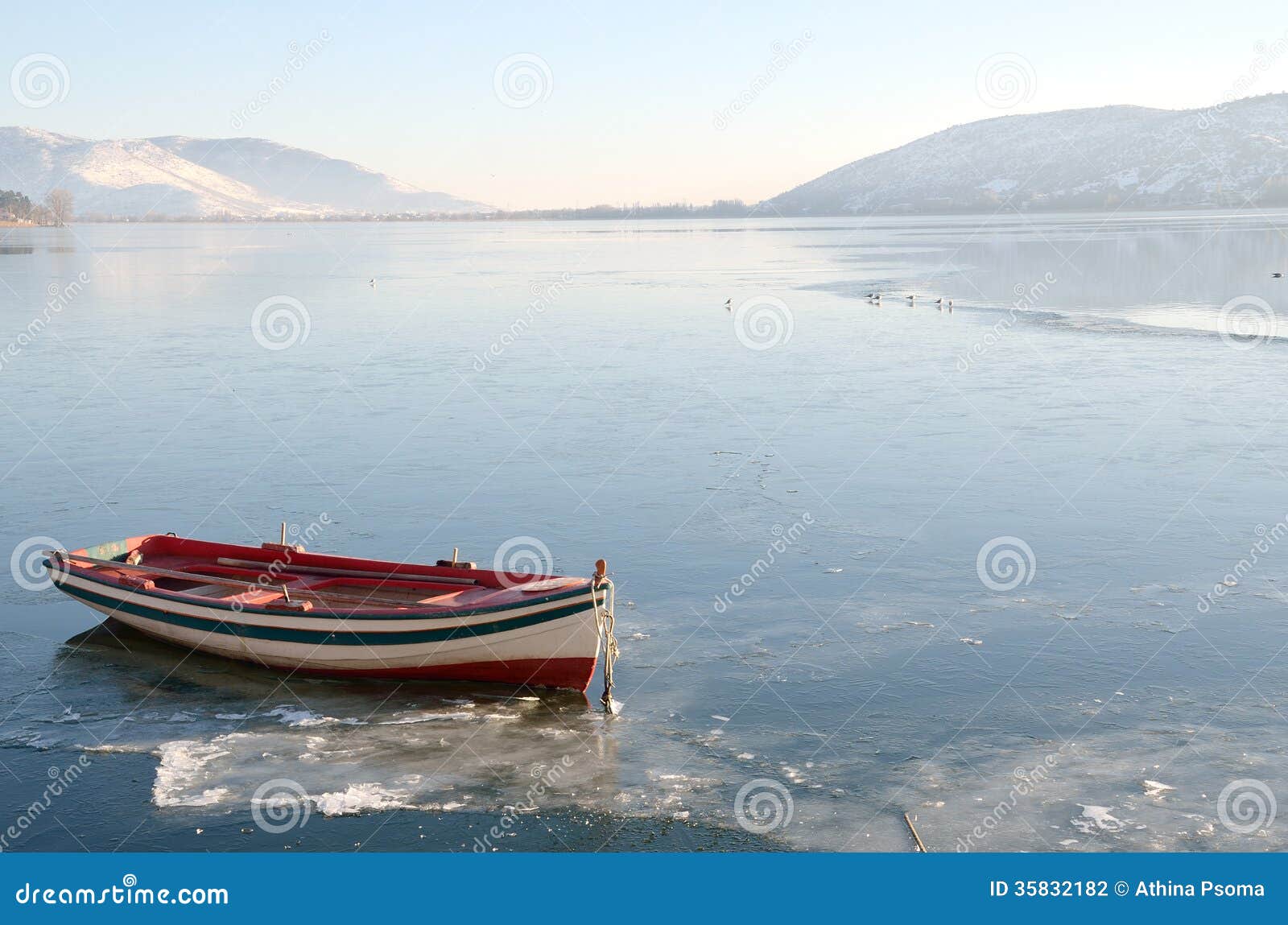 Boat in icy lake stock photo. Image of kastoria, winter - 35832182