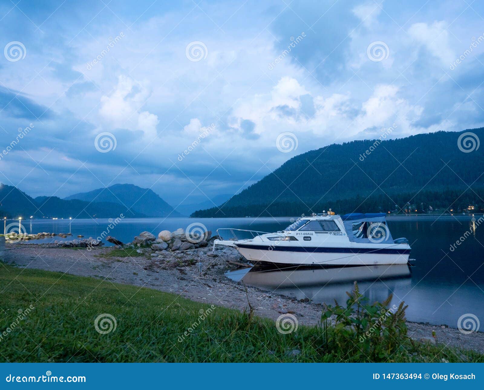 Boat on the lake at night stock photo. Image of night - 147363494
