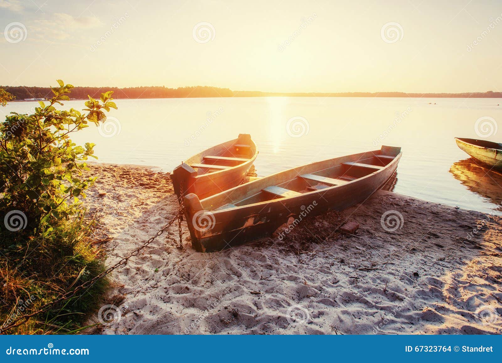 Boat on the lake at sunset stock photo. Image of navigation - 67323764