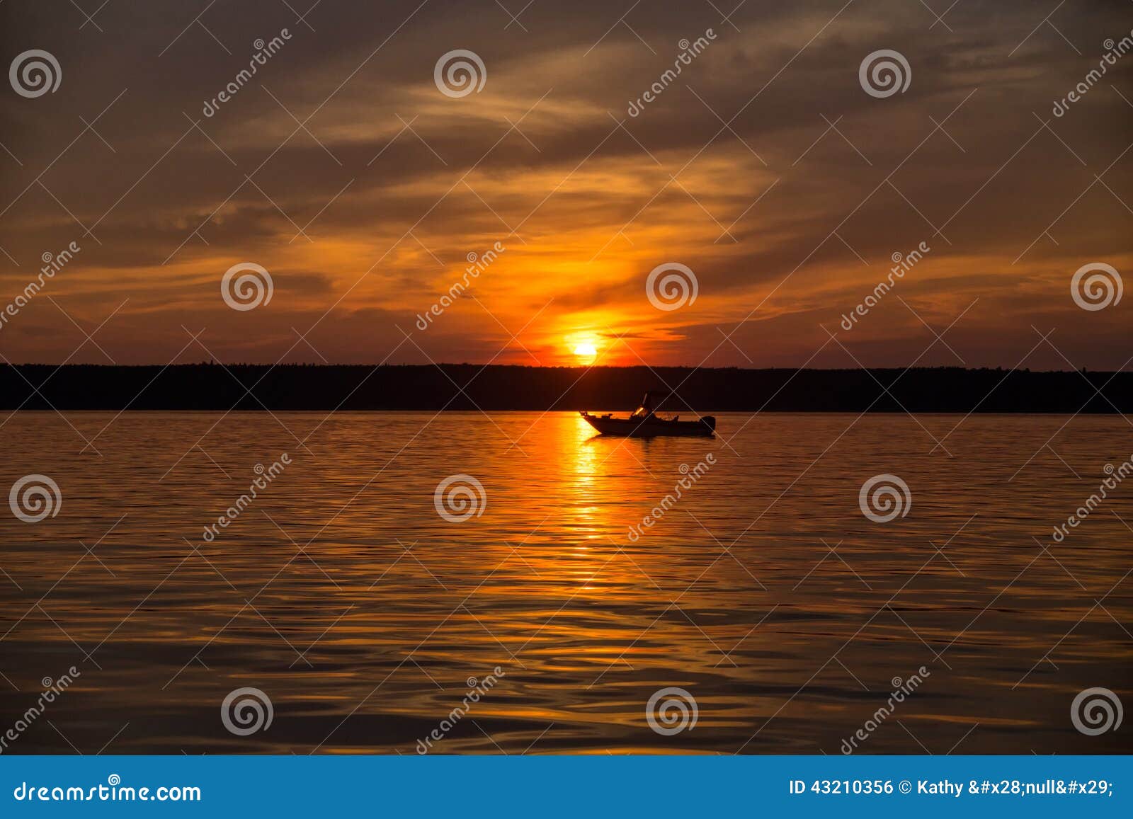 Boat on lake at sunset stock photo. Image of cloud, clouds - 43210356