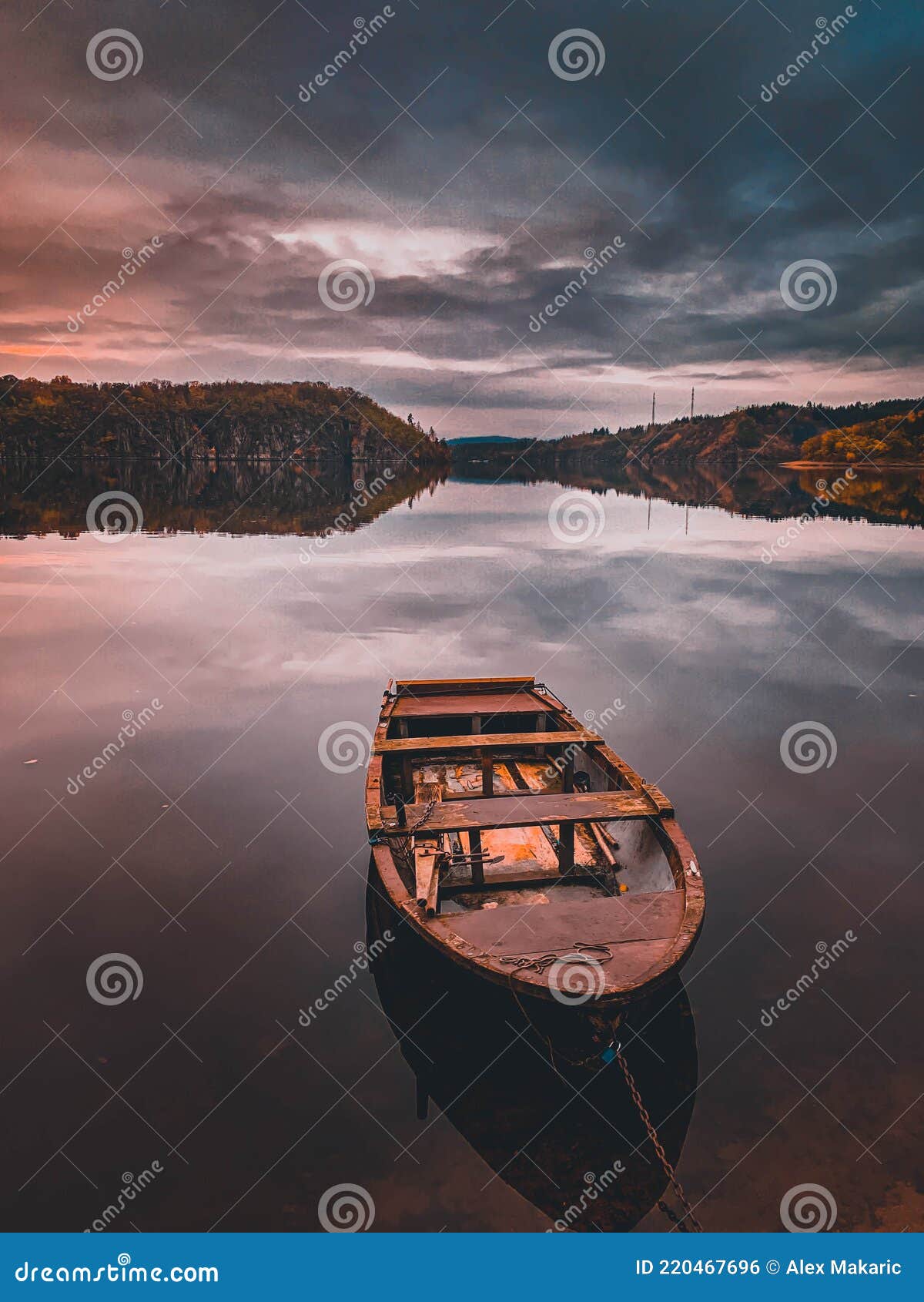 A boat on lake. Sunset stock photo. Image of buildings - 220467696