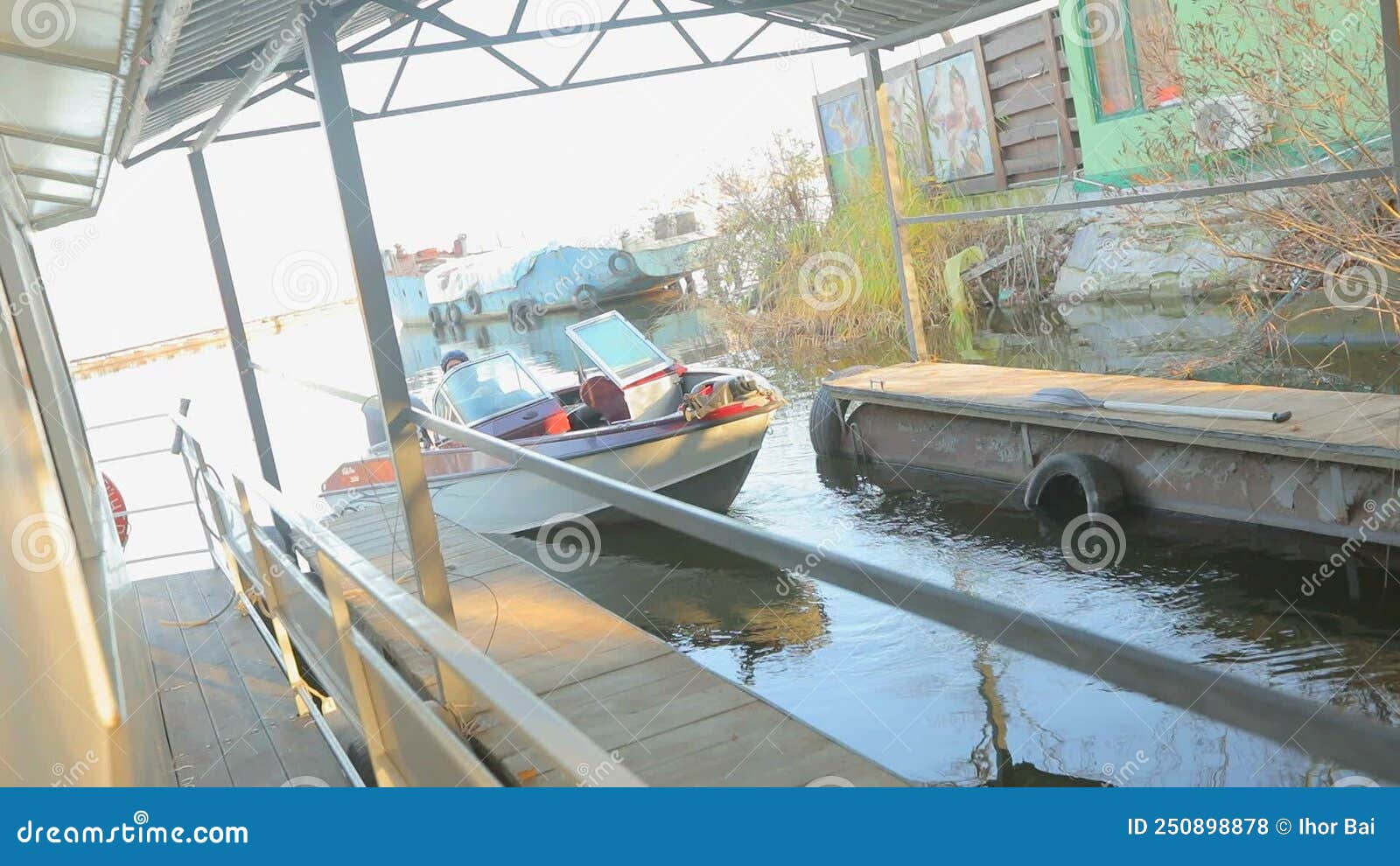 The Boat is Leaving the Dock. Motorboat Leaving the Boat Pier Stock ...