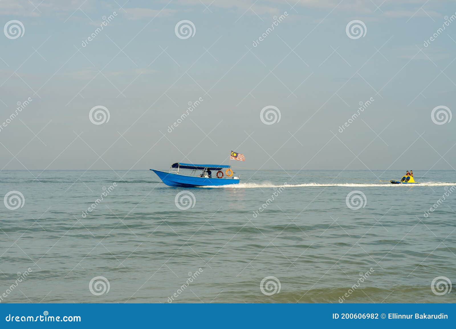 Boat with Malaysian Flag is Pulling Children Standing on the Floating ...