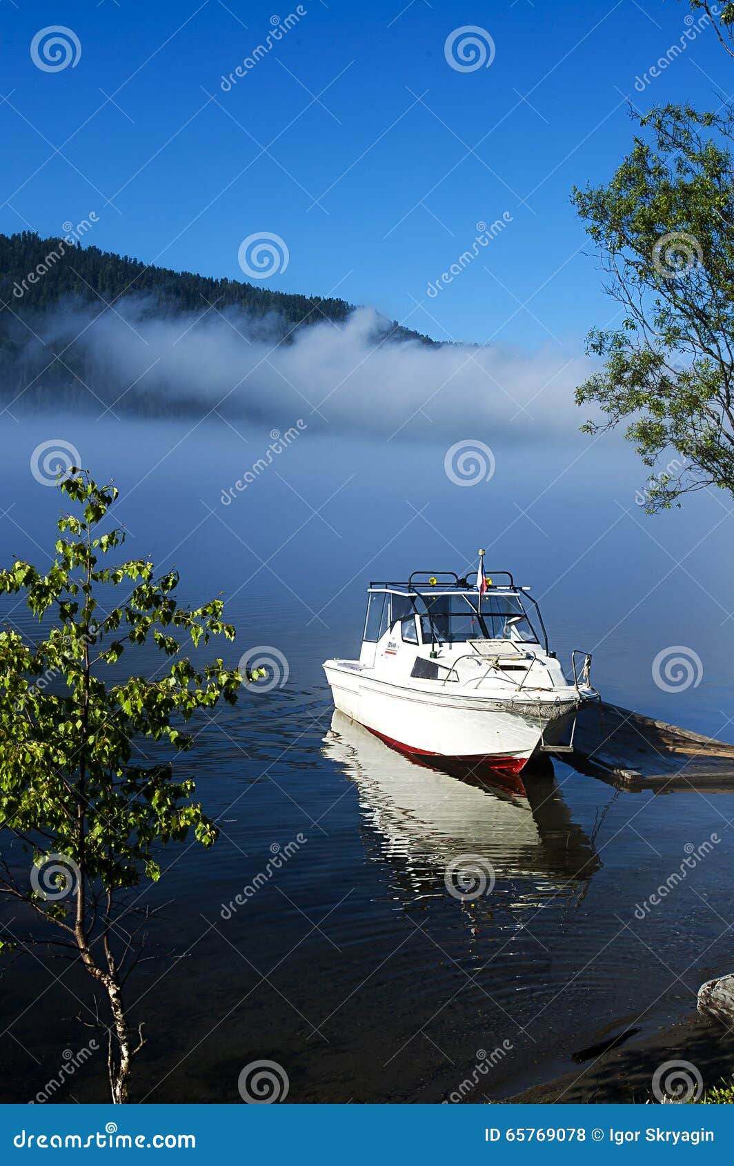 Boat in morning mist stock photo. Image of tour, dock - 65769078