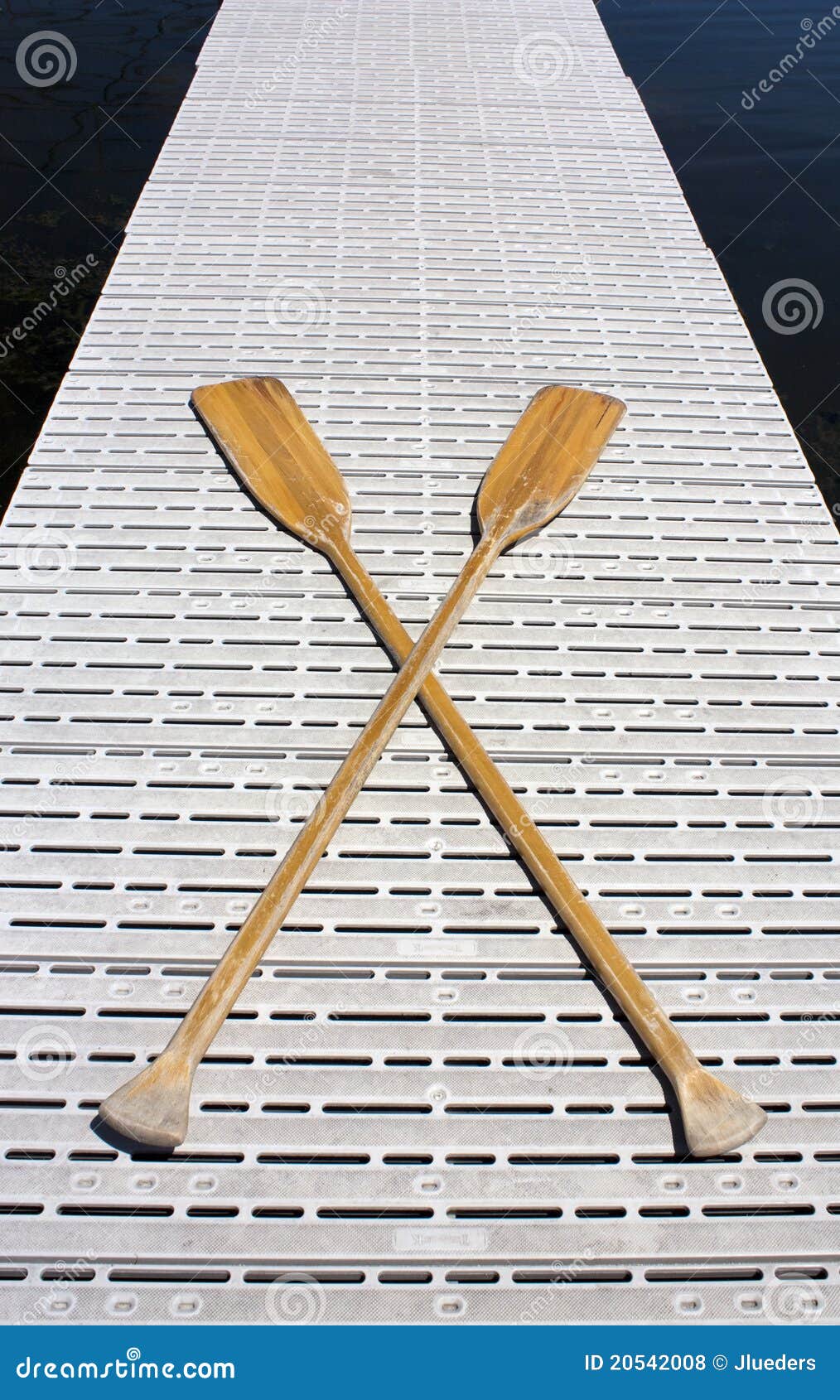 Boat Oars on a Dock stock photo. Image of paddle, deck - 20542008
