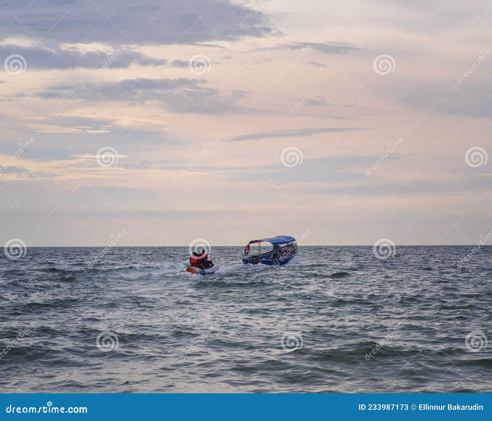 Boat Pulling Inflatable Ride at the Beach Editorial Stock Photo - Image ...