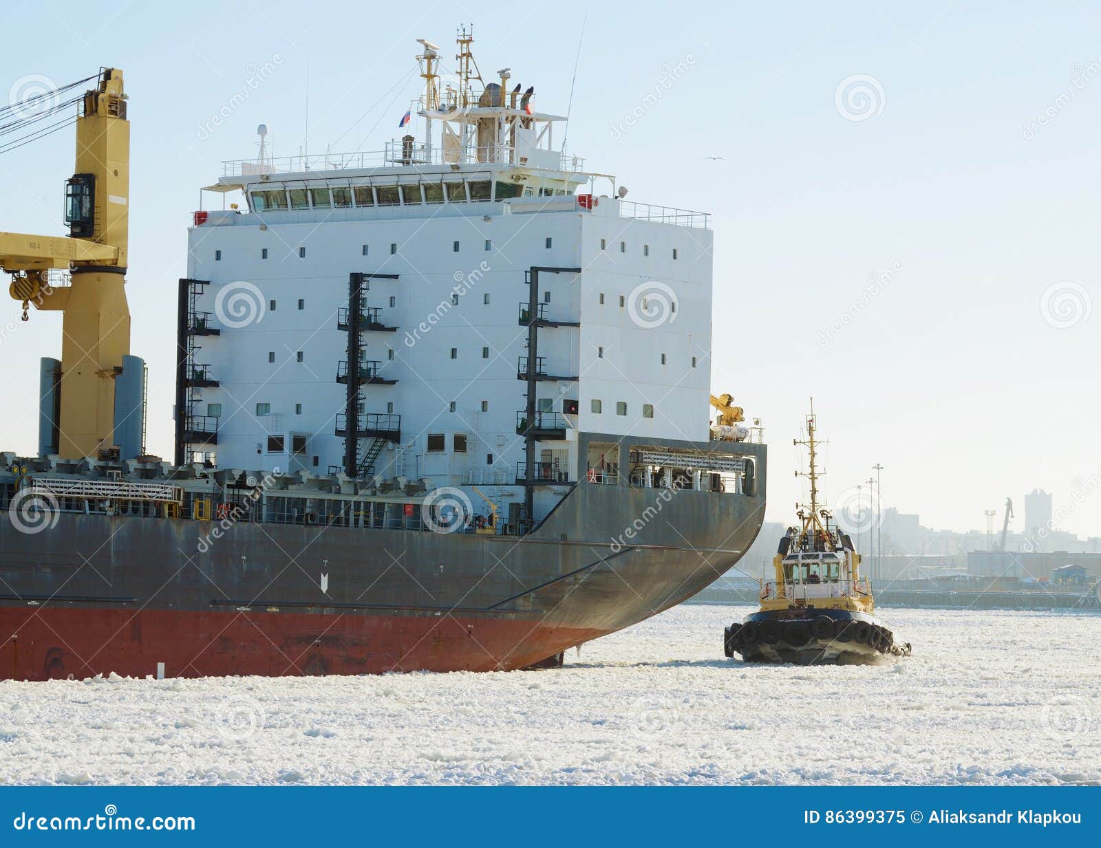 Boat pulling a tanker. stock image. Image of freight - 86399375