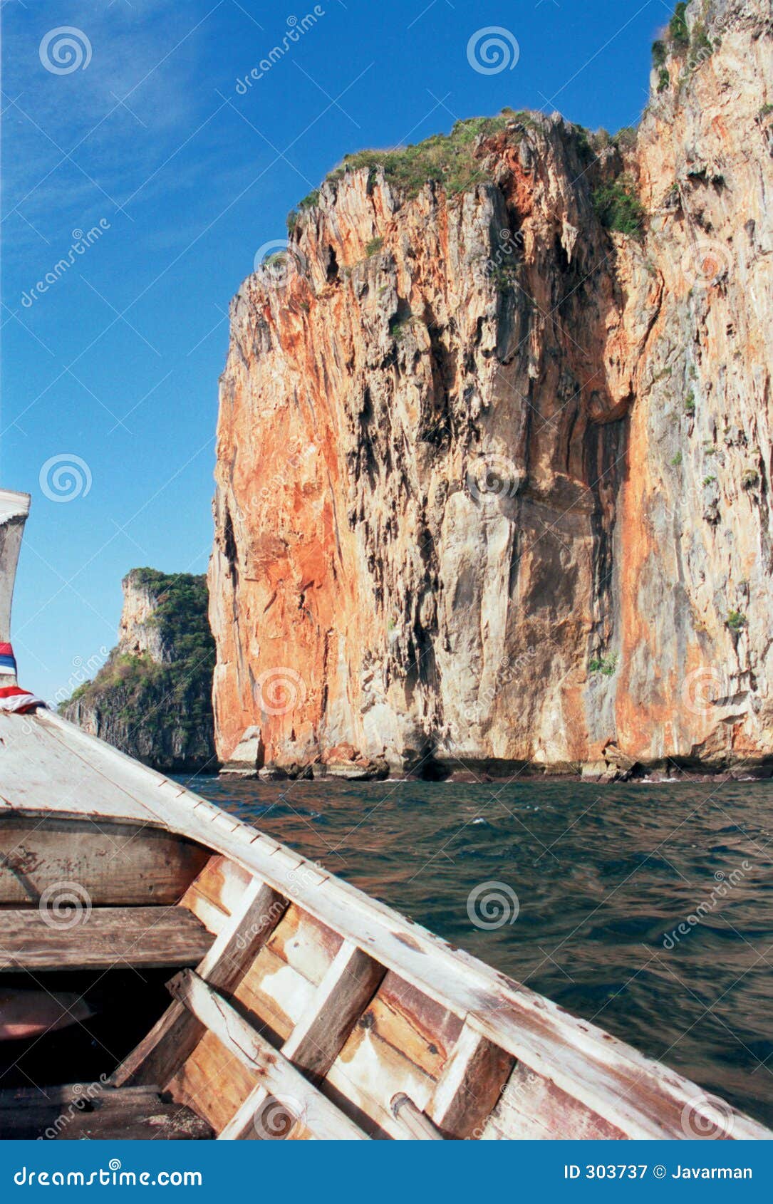 Boat and rock stock image. Image of shadow, phuket, seaside - 303737