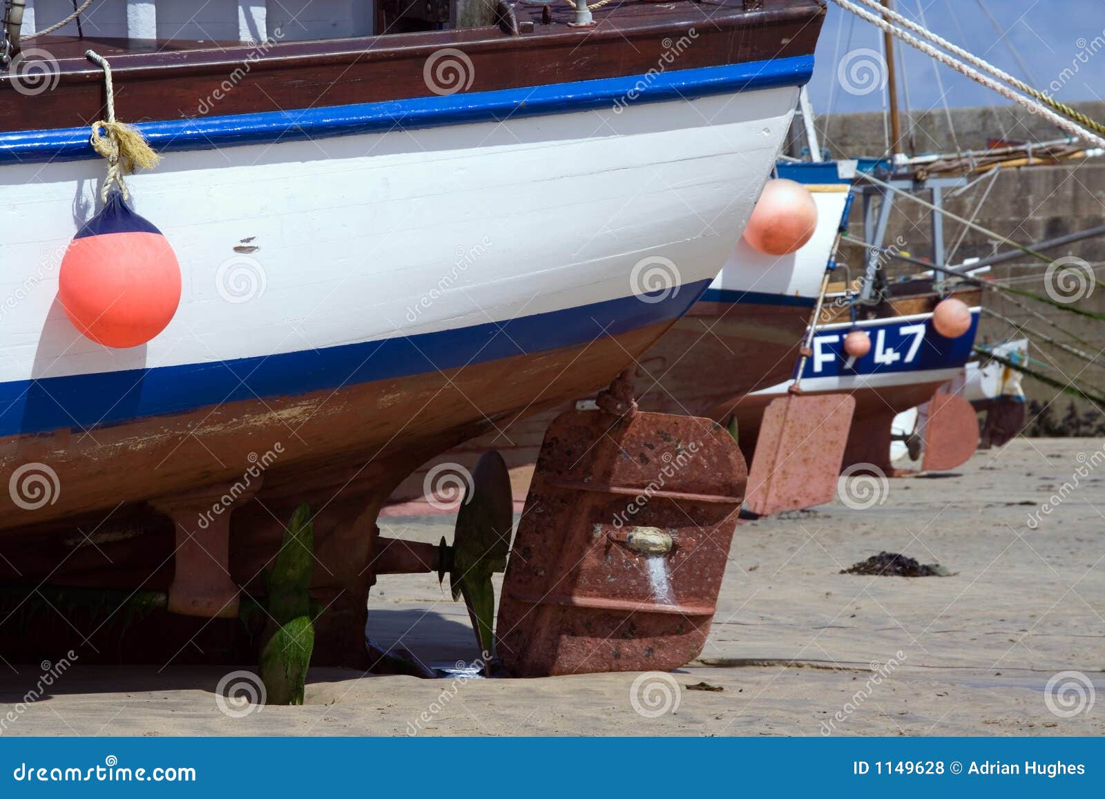 Boat Rudders at Low Tide stock photo. Image of chain, fisherman - 1149628