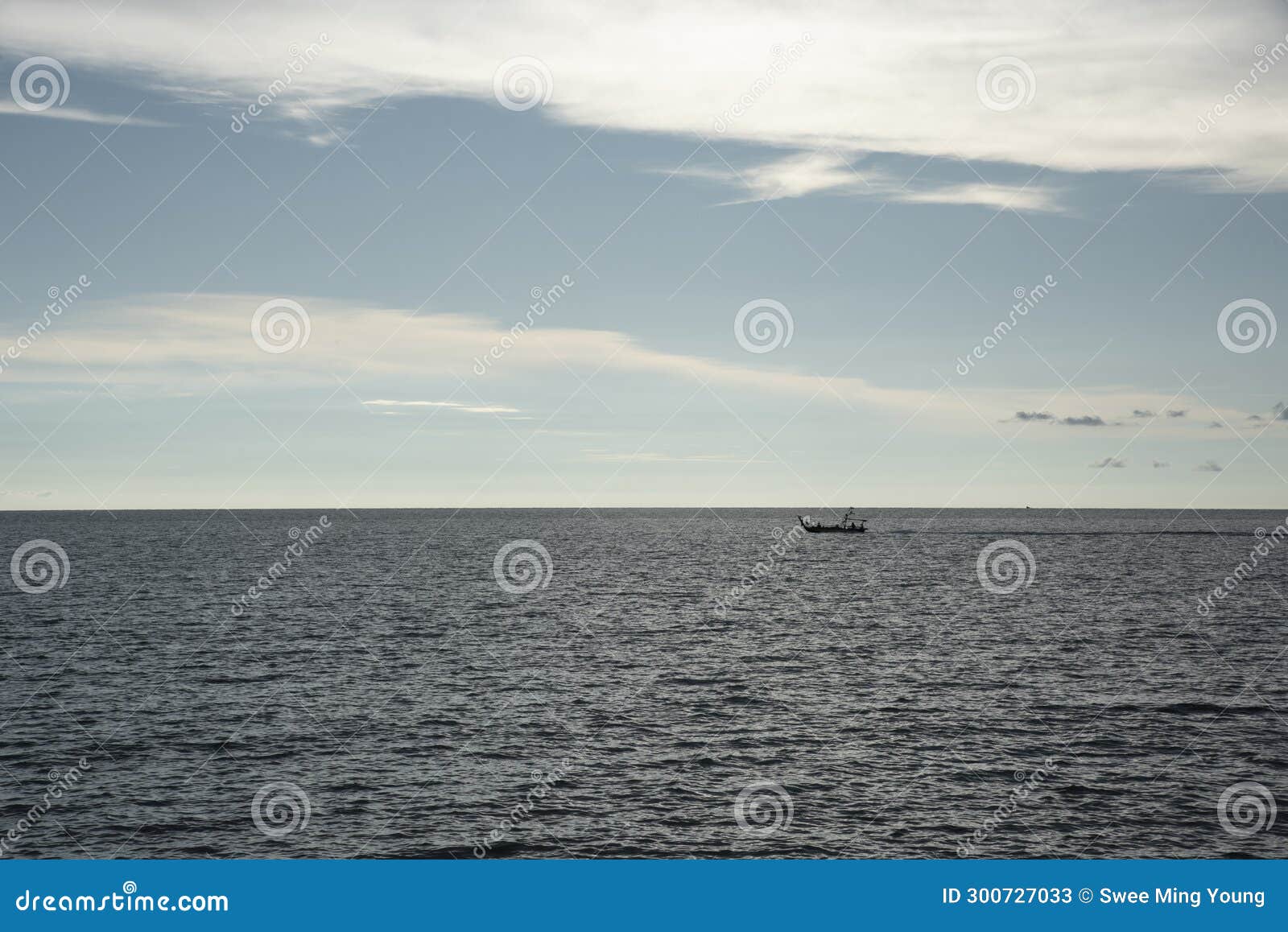 Boat Sailing Along the Distance Ocean in the Horizon. Stock Image ...