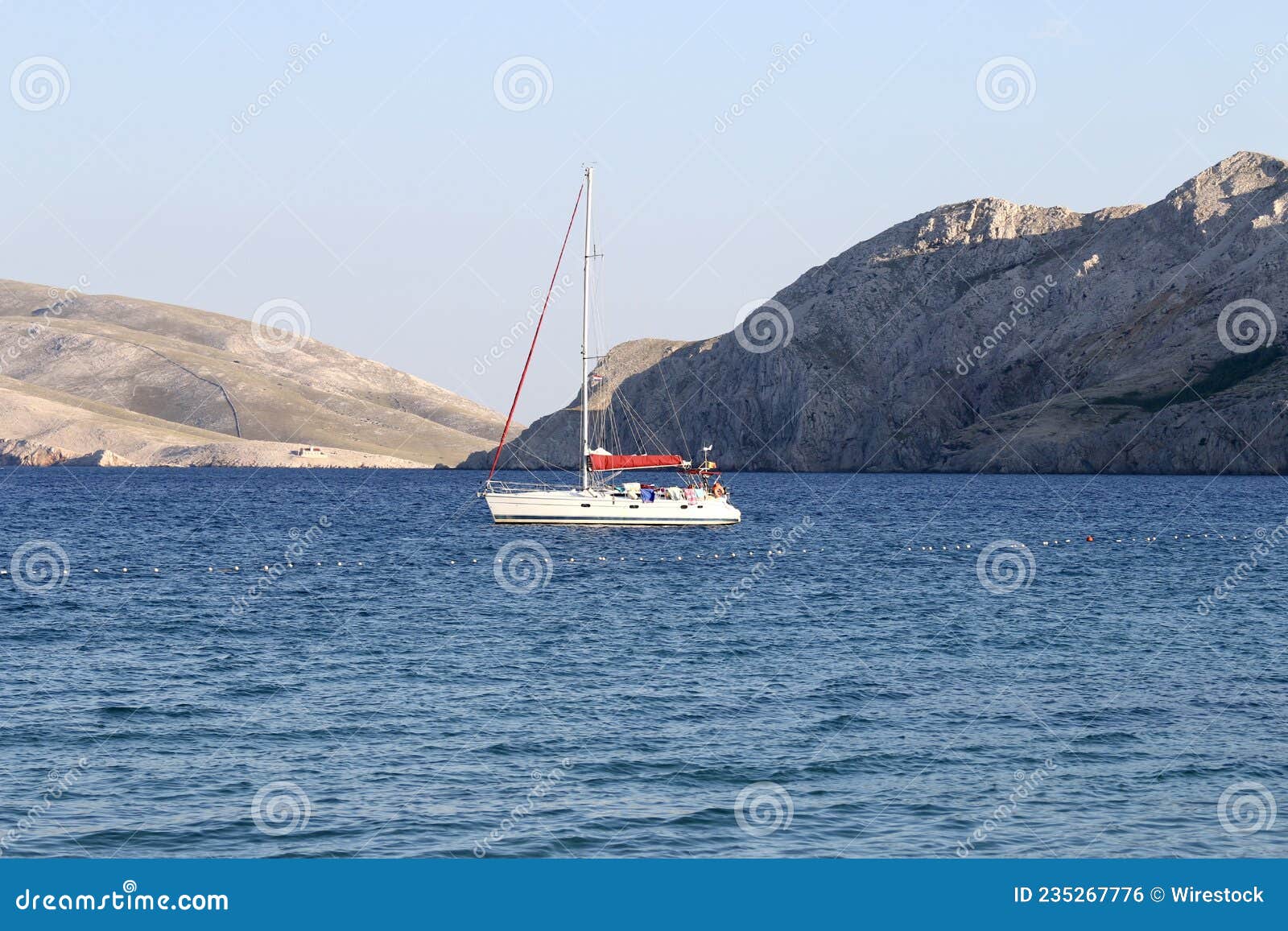 Boat sailing in a calm sea stock photo. Image of clouds - 235267776