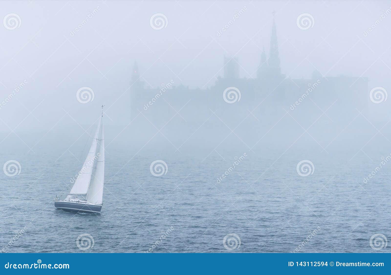 Boat in the sea in mist stock photo. Image of ocean - 143112594