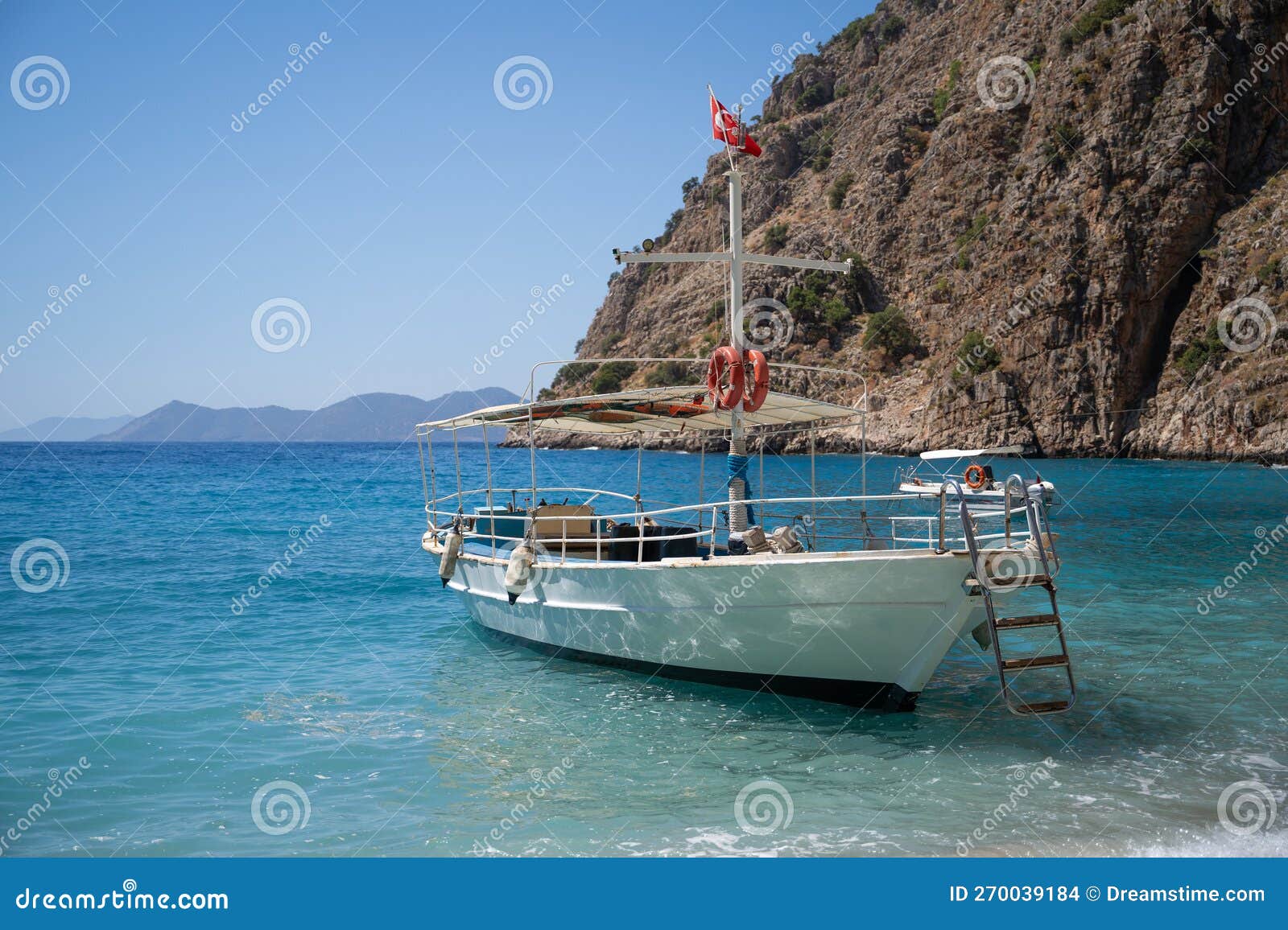 Boat on the seashore stock photo. Image of vacation - 270039184