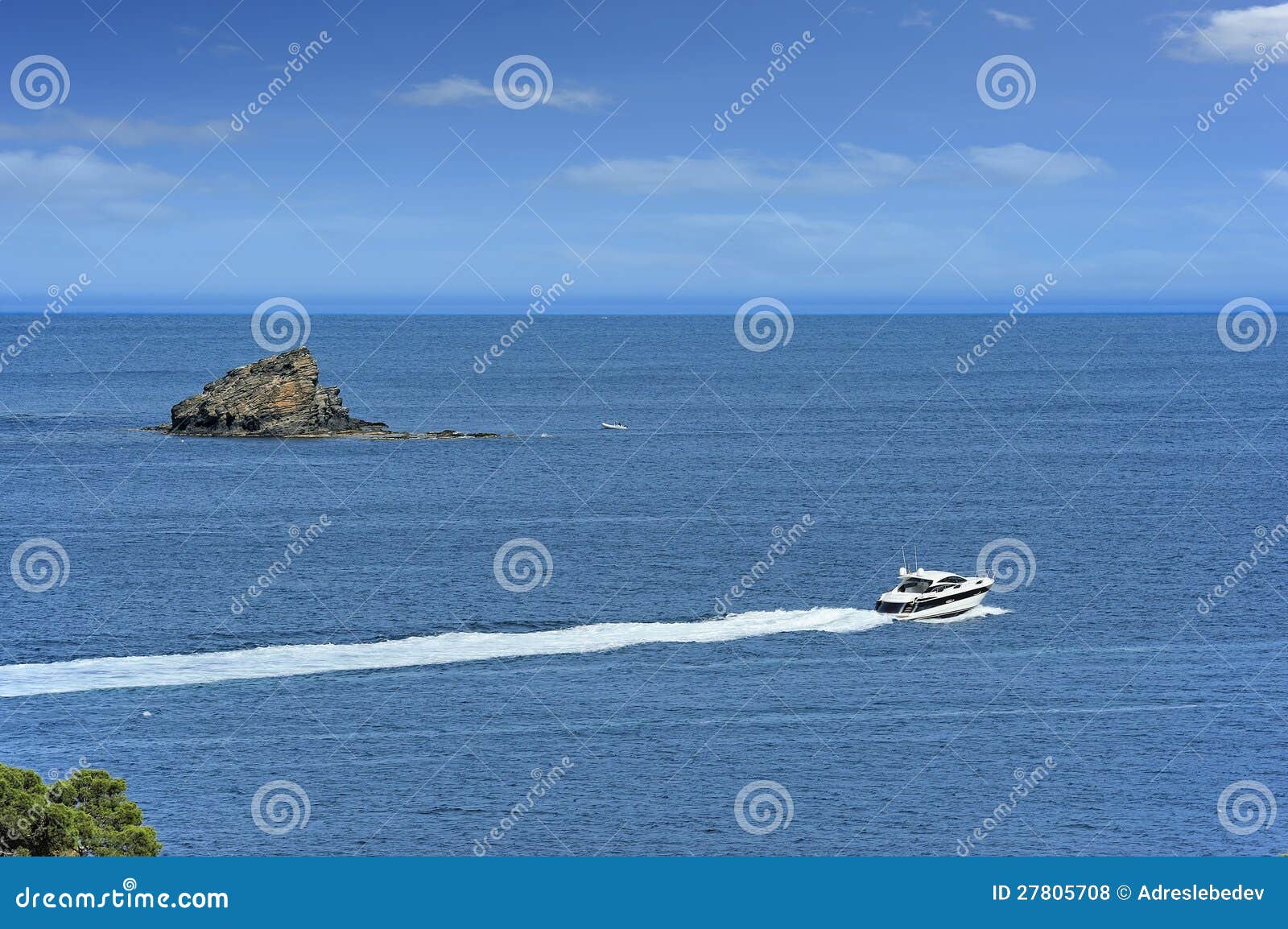 Boat and Shark-fin Shaped Rock Near Cadaques Stock Photo - Image of ...