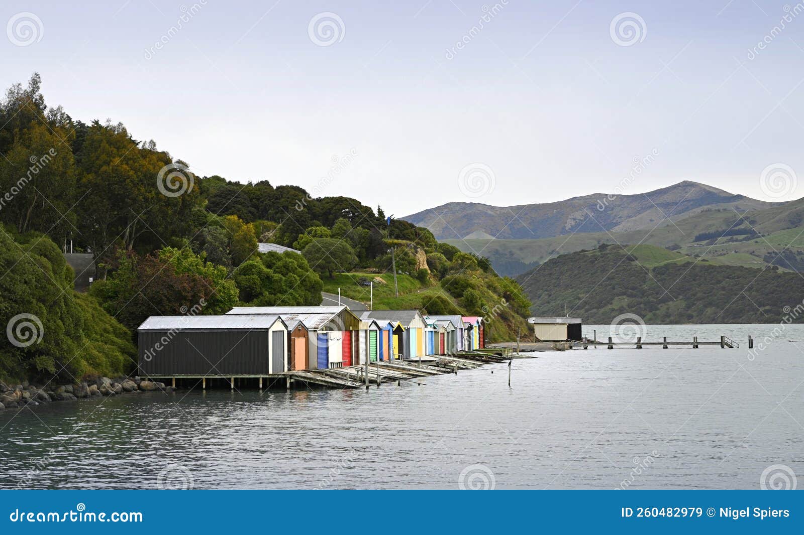 Boat Sheds on the Shore of Robinsons Bay, Akaroa, NZ Stock Image ...