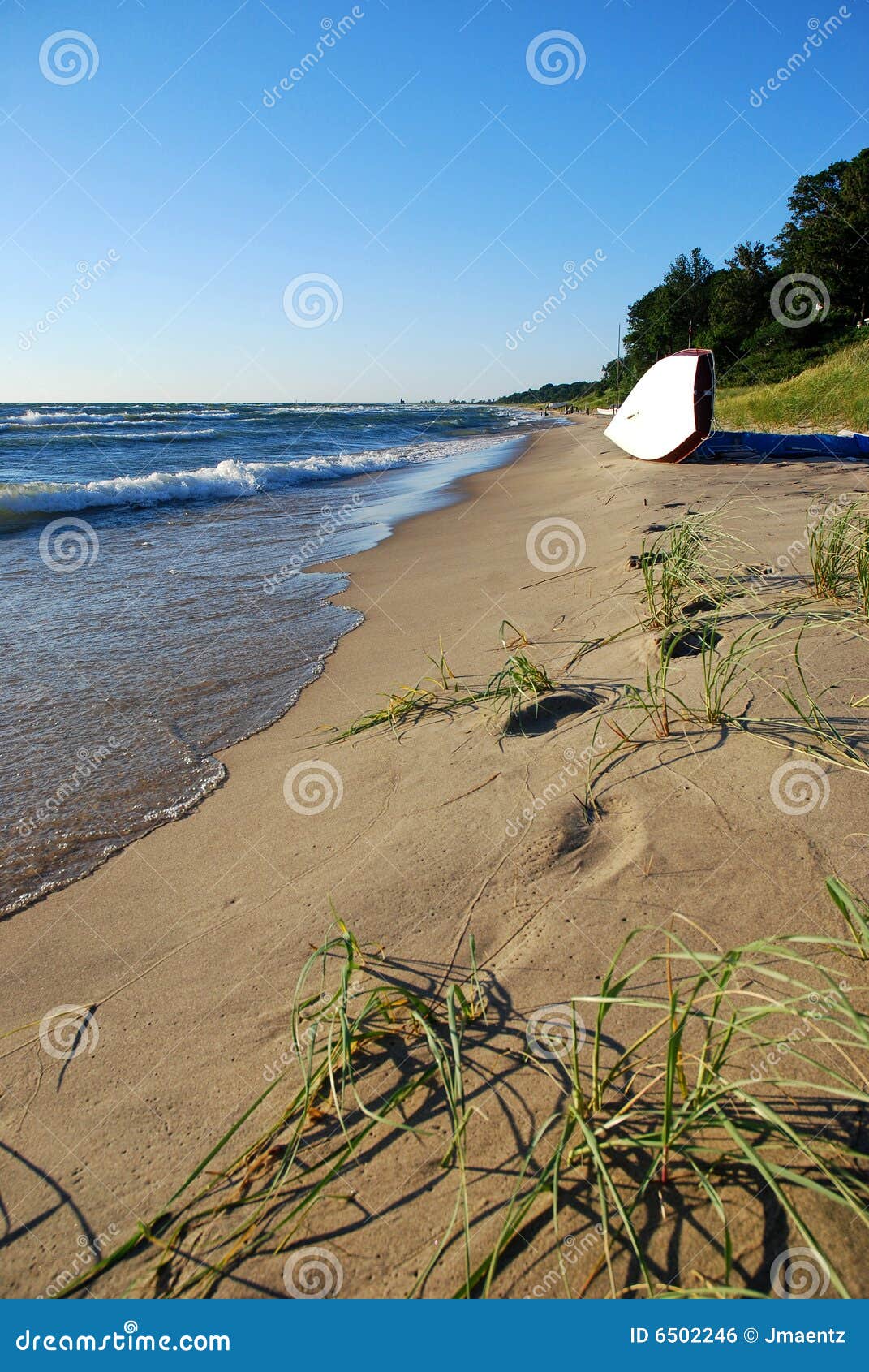 Boat on Shore of Lake Michigan Stock Photo - Image of grass, cottage ...