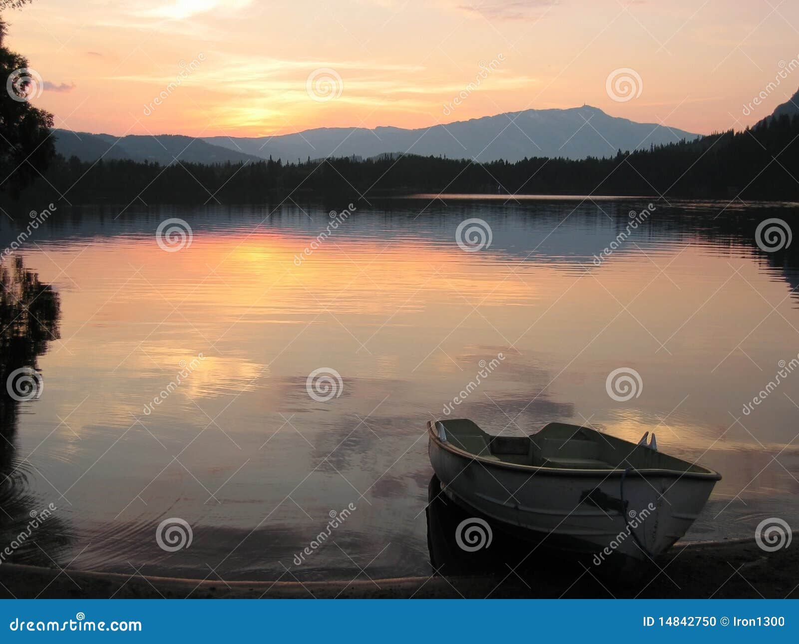 Boat on the Shore of the Lake at Sunset Stock Photo - Image of outdoors ...
