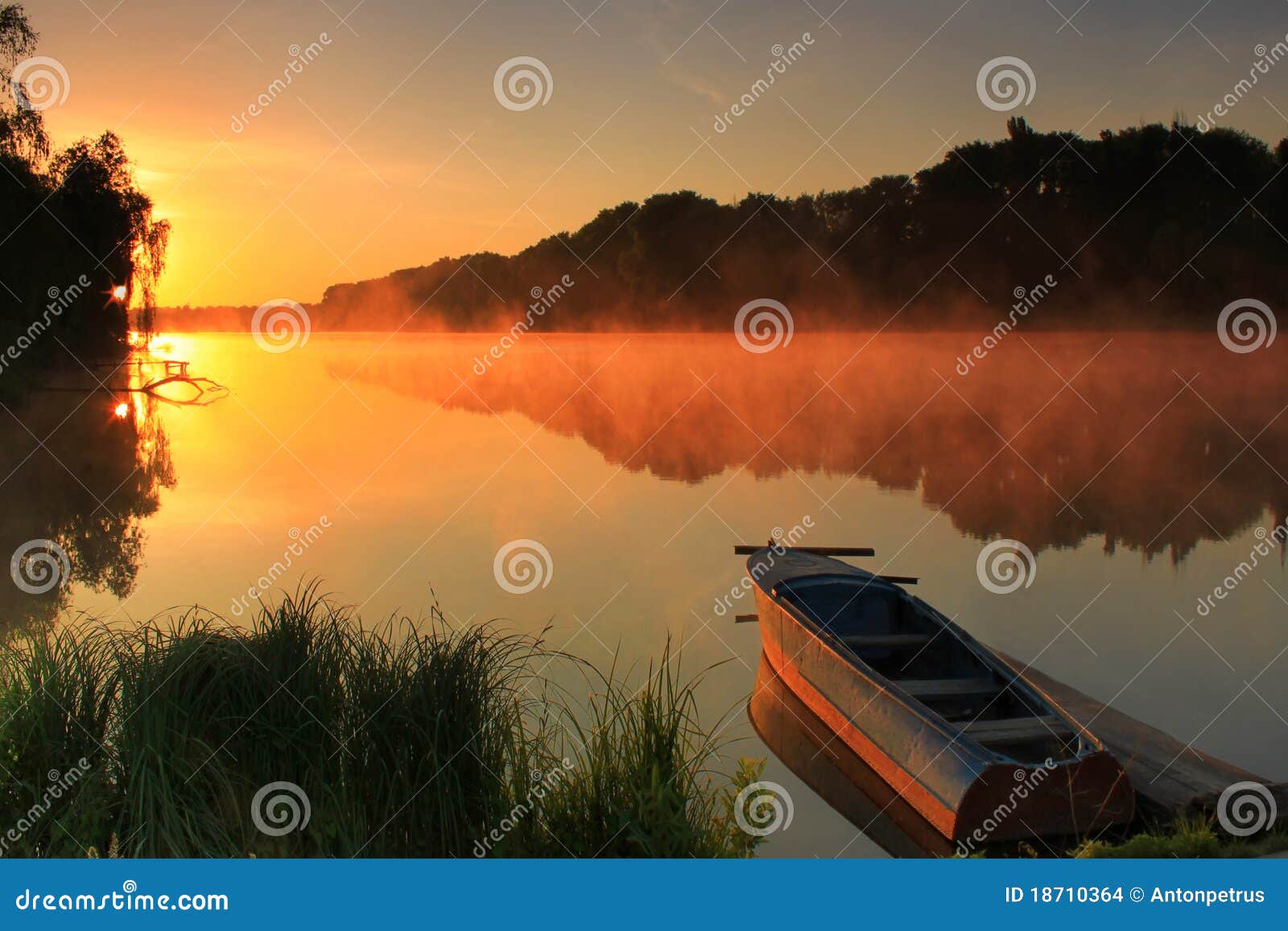 Boat on the Shore of a Misty Lake Stock Photo - Image of calm, nature ...