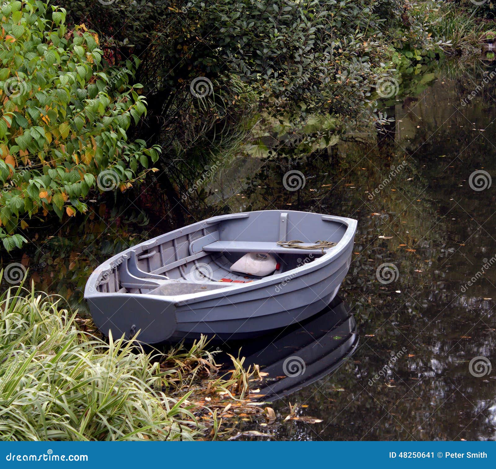 Boat on a stagnant pond stock image. Image of scull, wood - 48250641