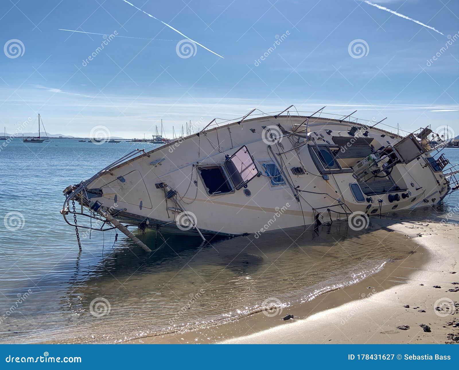 Boat Stranded on the Beach after a Storm. on a Sunny Day with Few ...
