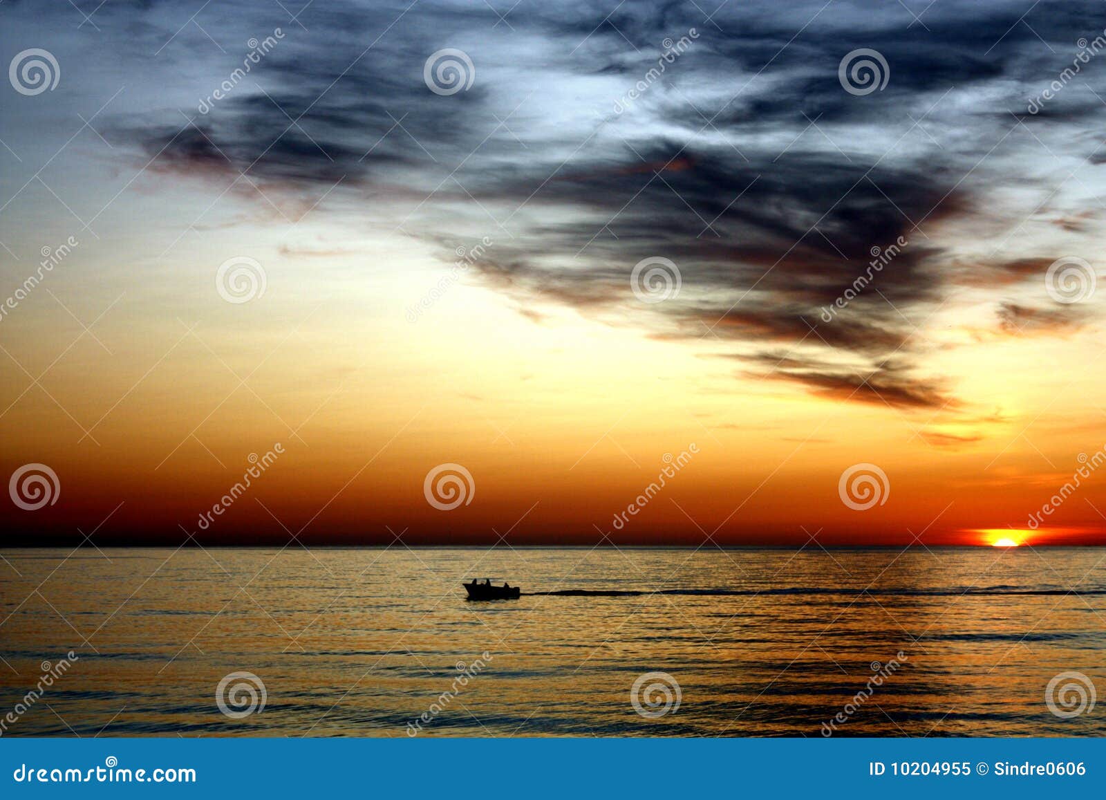 Boat in sunset stock image. Image of wave, clouds, boat - 10204955