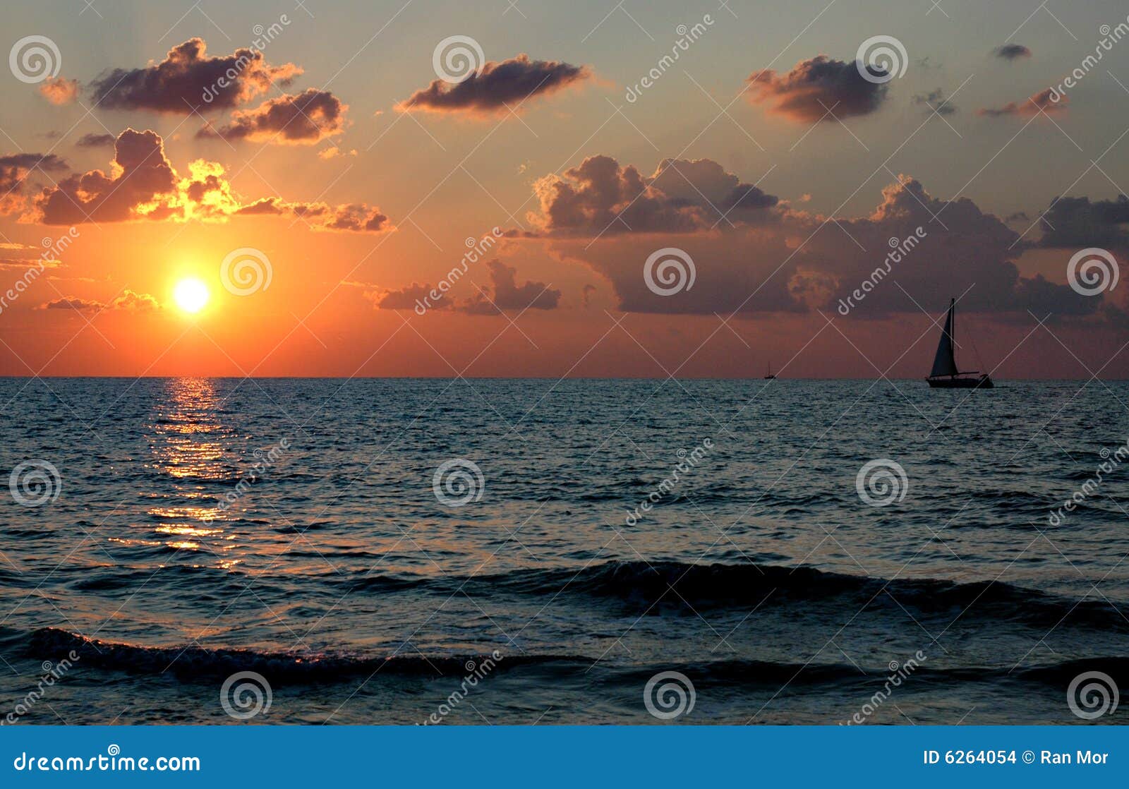 Boat at Sunset stock photo. Image of water, waves, sunset - 6264054