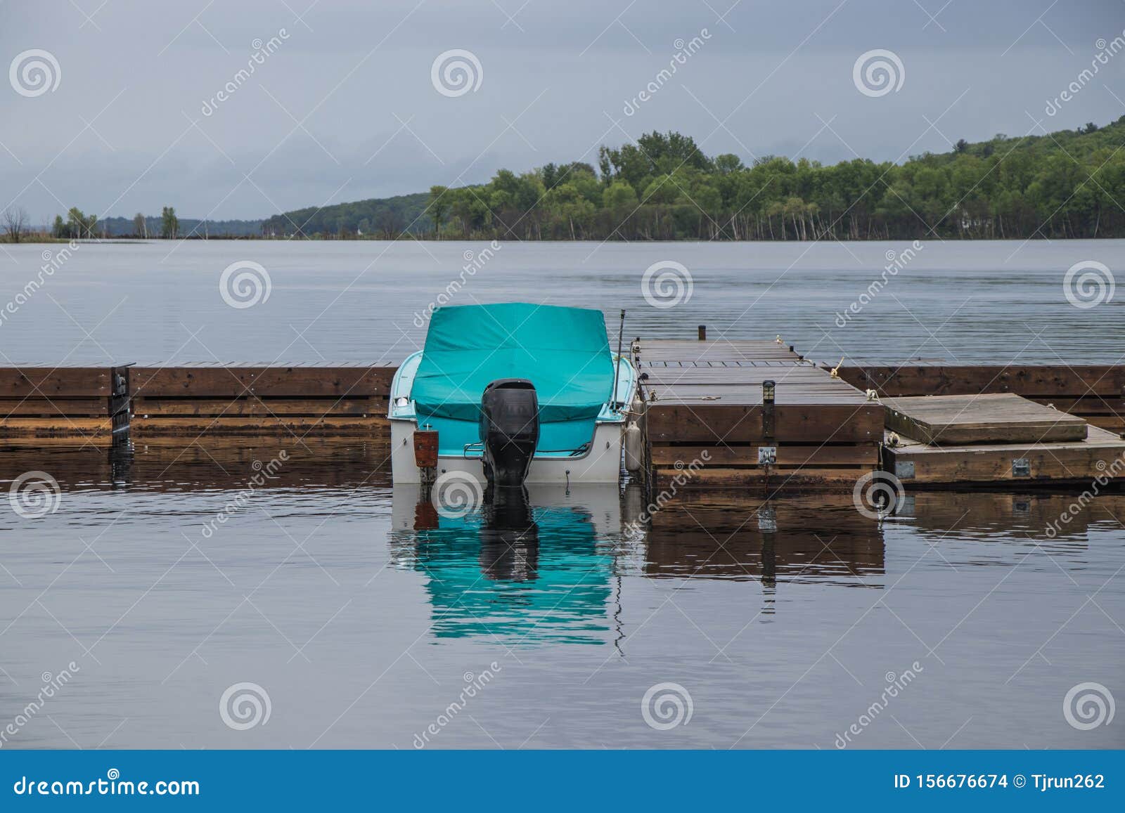 Boat Tied To A Dock On A Cloudy Day Stock Photo - Image of marina ...