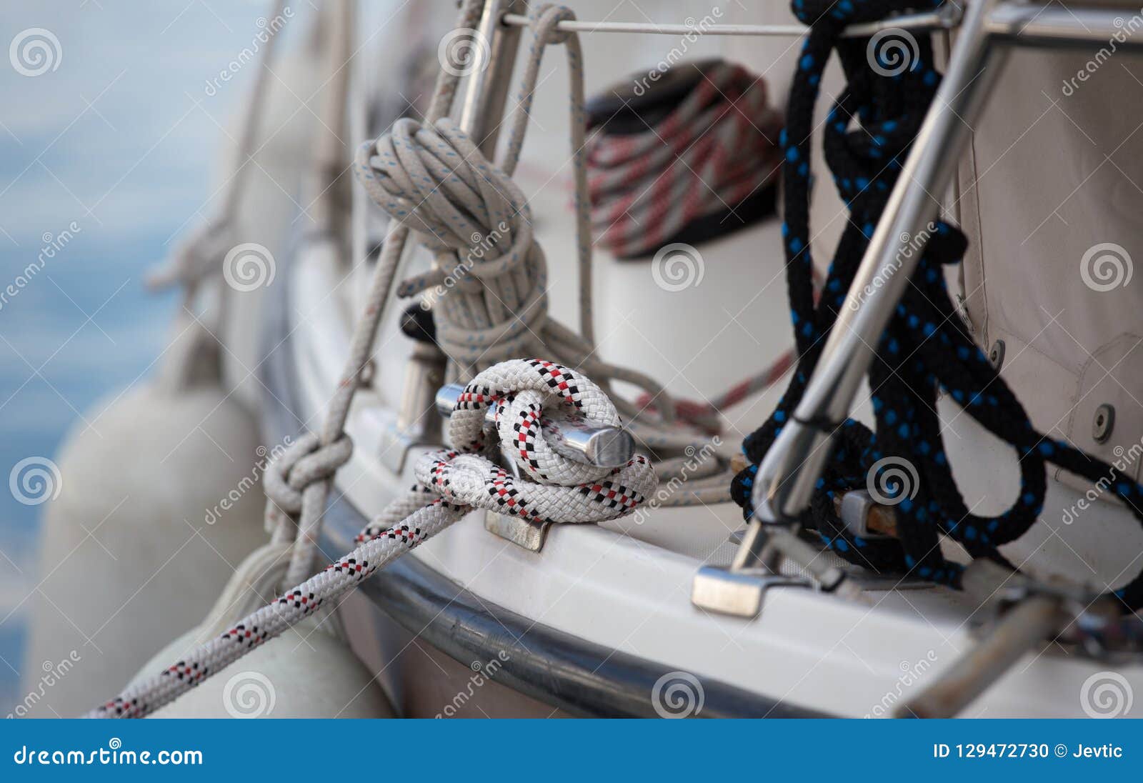 Boat Tied To Dock with Ropes Stock Photo - Image of boat, detail: 129472730