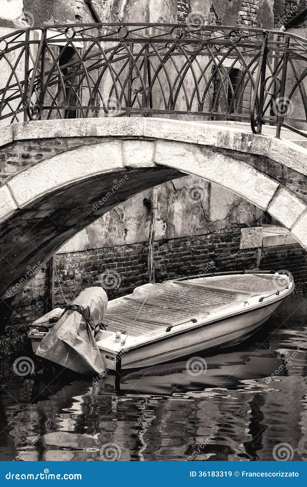 Boat Under a Bridge in Venice. Black and White Stock Image - Image of ...