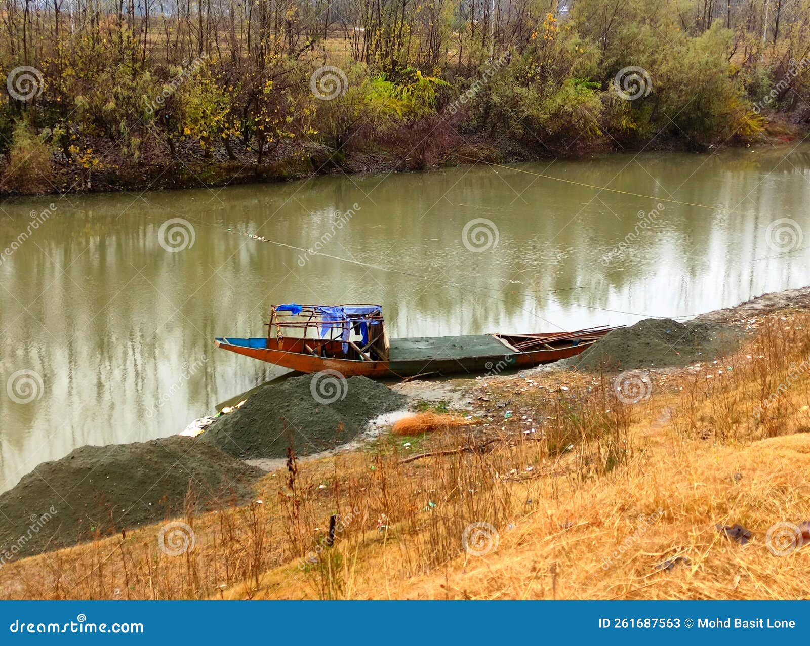 A Boat Used To Extract Sand Manually in a River. Stock Image - Image of ...