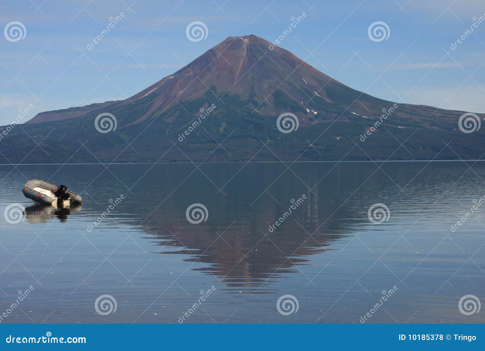 Boat at volcano shadow 1 stock photo. Image of edge, floating - 10185378