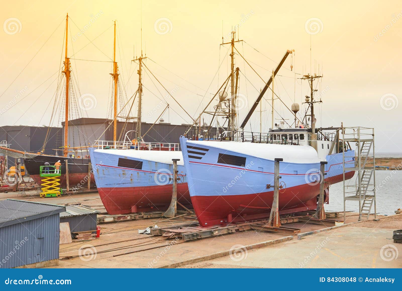 Boat with Workers in a Boatyard Being Repaired Stock Photo - Image of ...