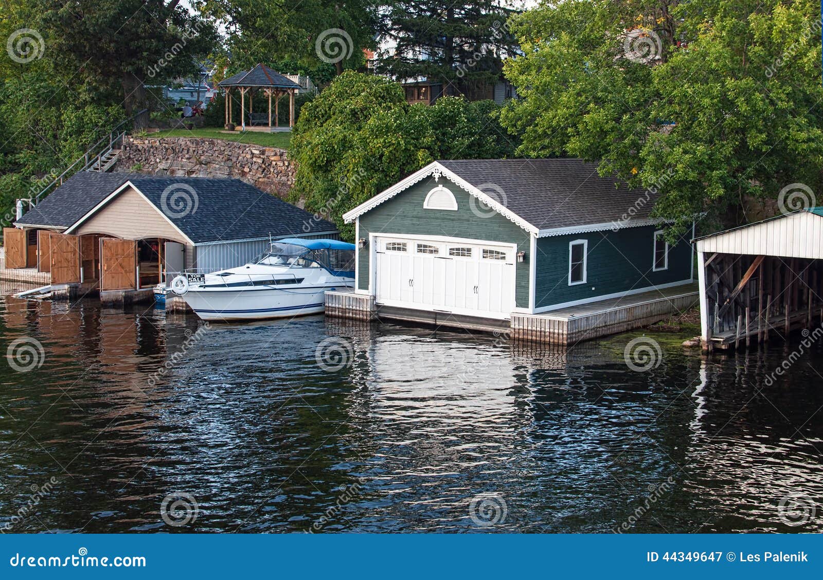 Boathouses on a river stock image. Image of dock, summer - 44349647