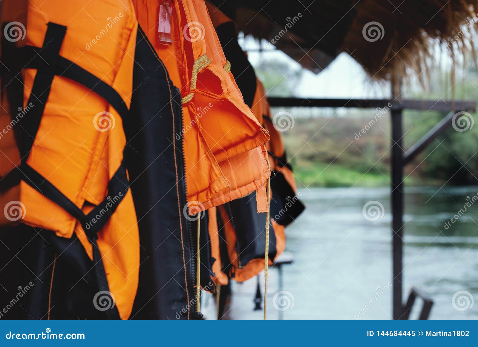 Boating Life Jackets Hanging on Rack on Pier Stock Image - Image of ...