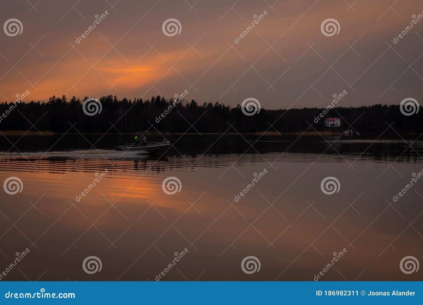 Boating at sunset stock image. Image of boating, sunset - 186982311