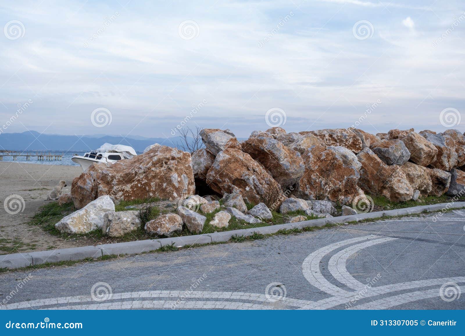 Boats on the Background of the Harbor. Rocks on the Seashore Stock ...