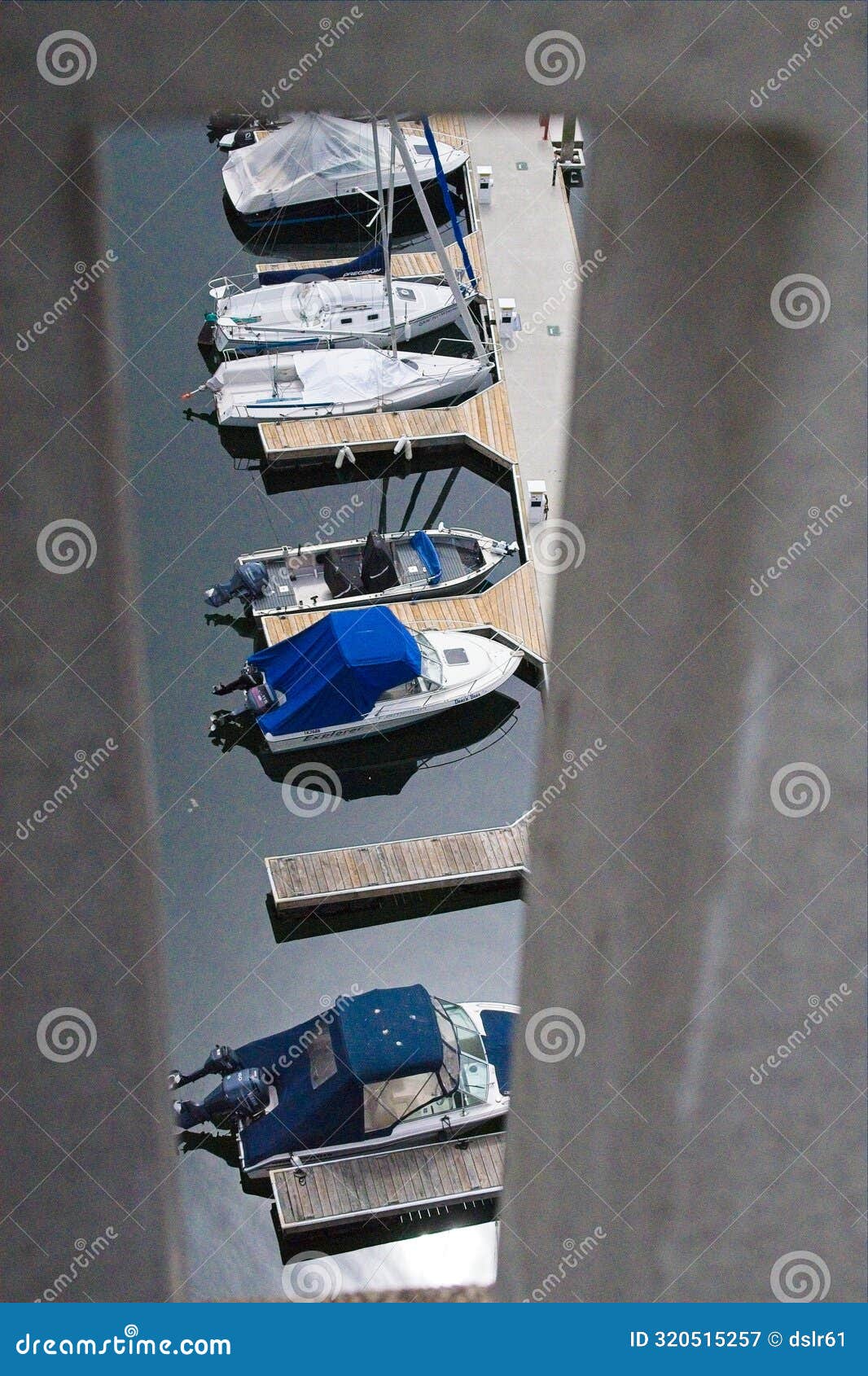 Boats Docked at Marina Seen through Vertical Gap Editorial Photography ...
