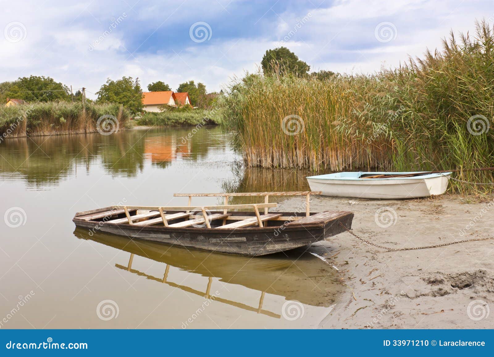Boats at the lakeside stock photo. Image of green, peaceful - 33971210