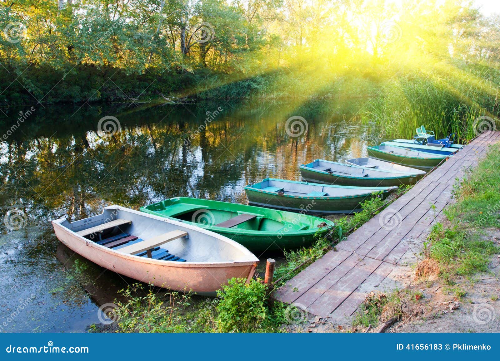 Boats on moorage stock image. Image of duckweed, chain - 41656183
