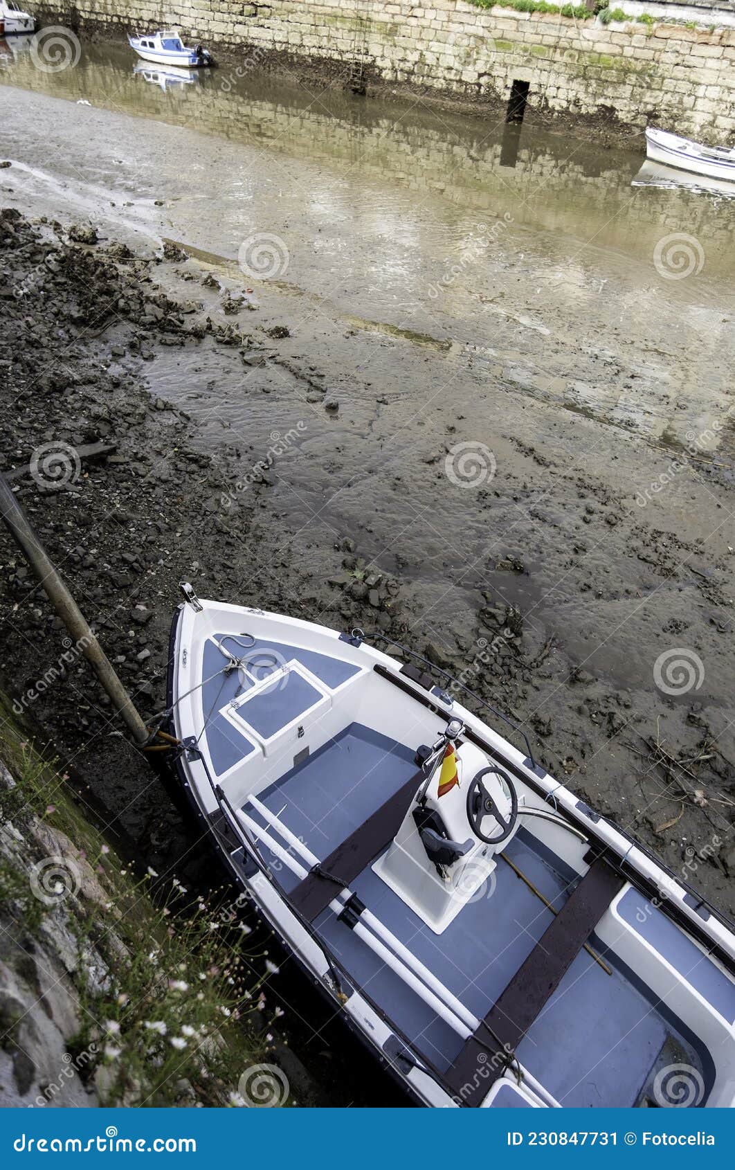 Boats stranded on a dock stock image. Image of destroyed - 230847731