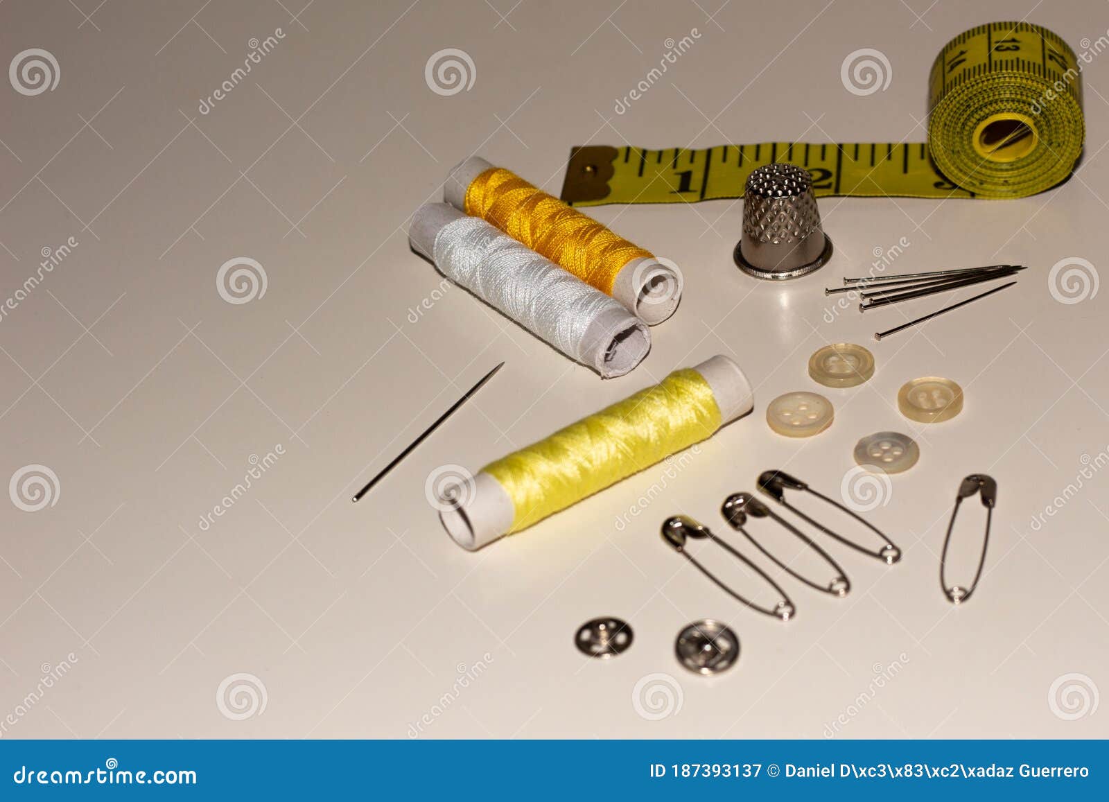 Bobbins of Different Shades of Yellow and More Sewing Utensils with ...