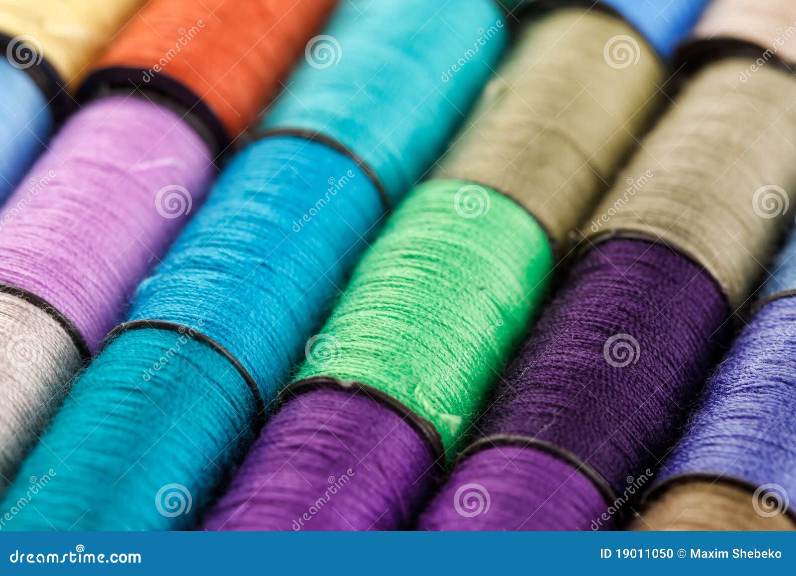 Bobbins of lurex thread stock photo. Image of detail - 19011050