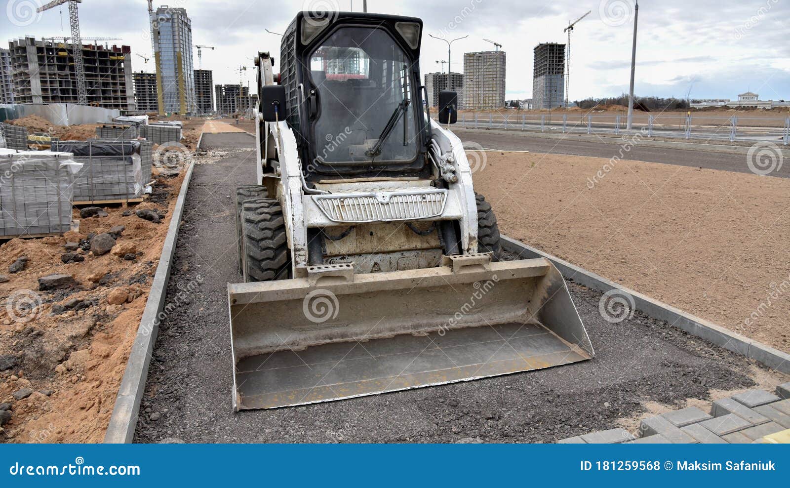 Bobcat Skid-steer Loader And Mini Road Roller During Roadwork. Paving ...