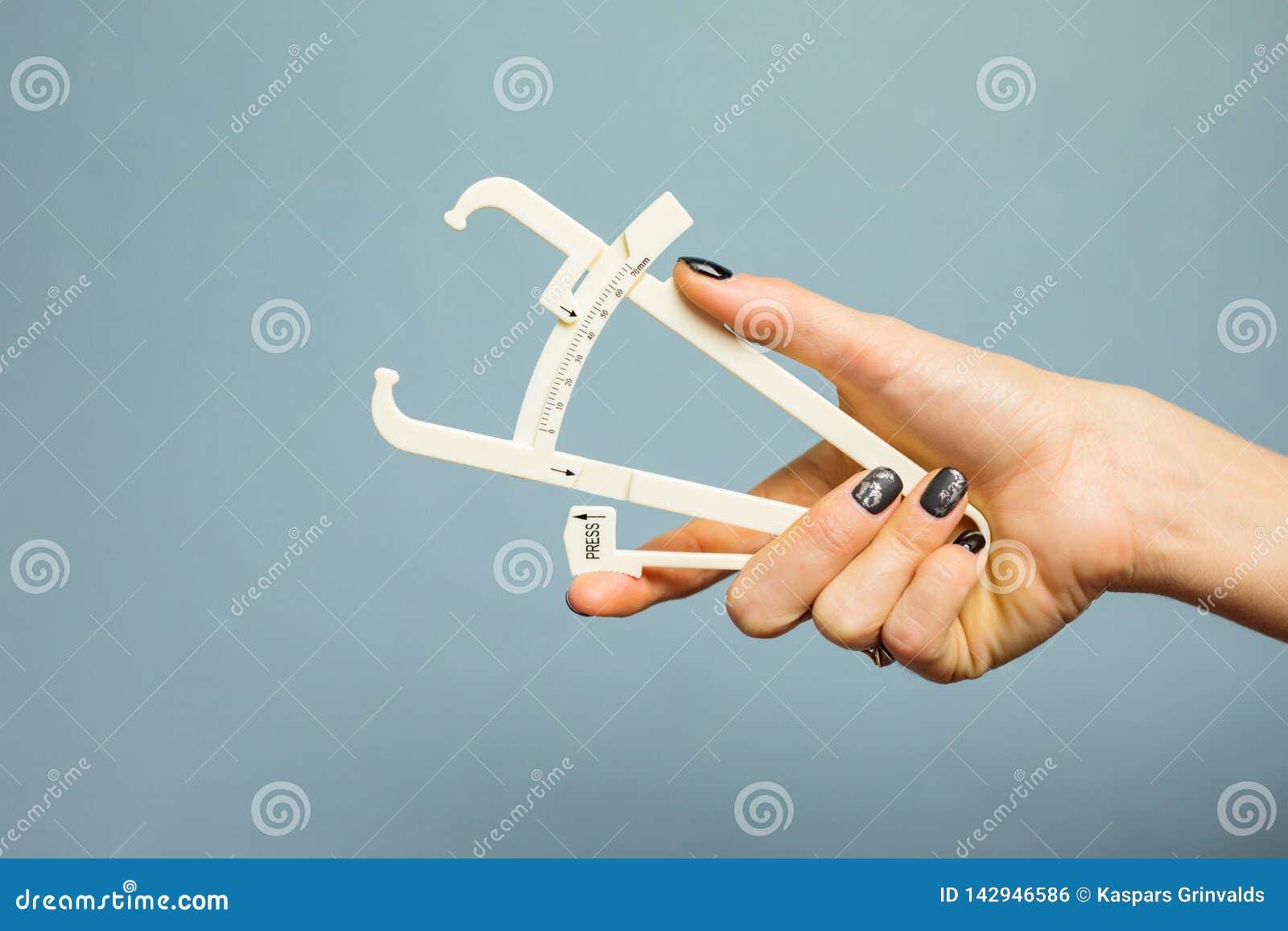 Body fat caliper stock photo. Image of caliper, grey - 142946586