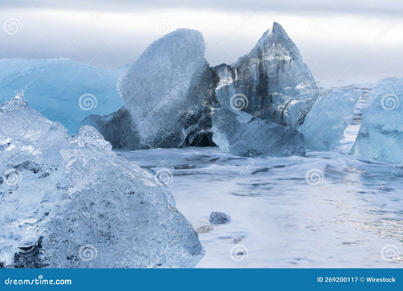 Body of Water Featuring Several Large Chunks of Ice Floating on the ...