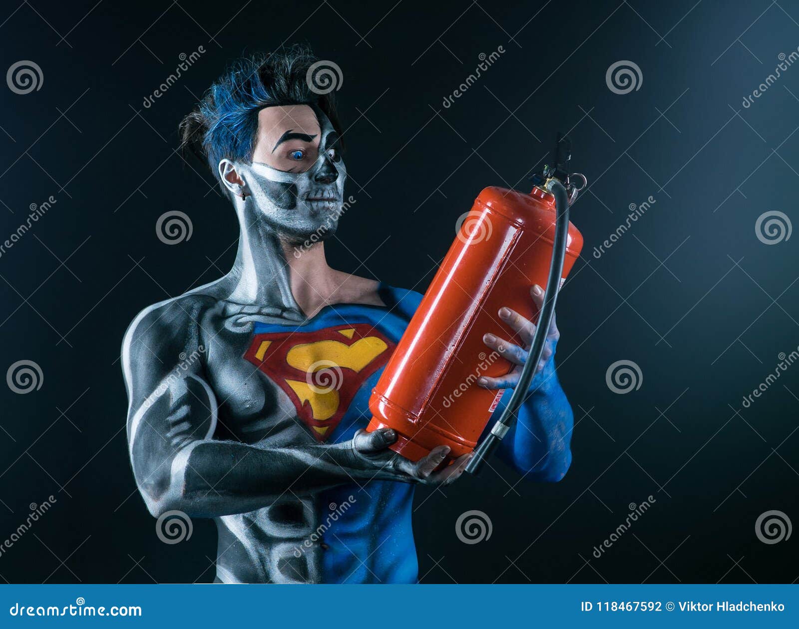 Bodyart of a Super Hero Holding a Fire Extinguisher in the Hands ...
