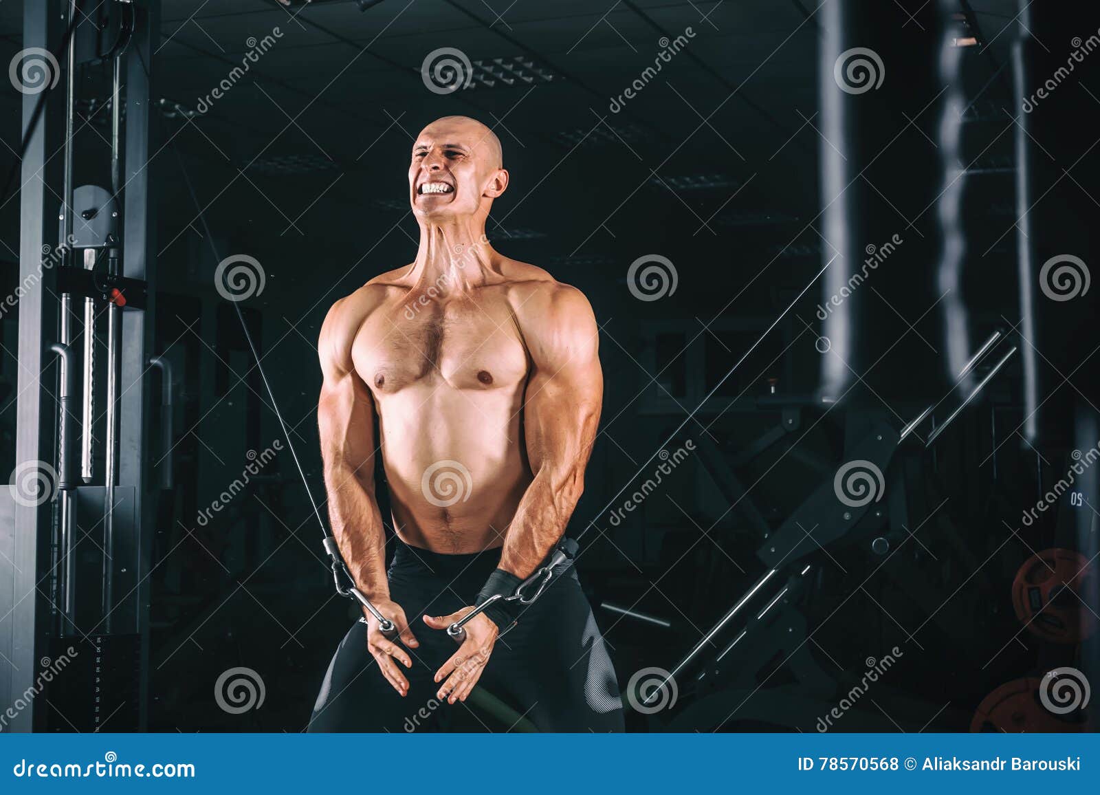 Bodybuider Demonstrate Crossover Exercises in the Gym. Stock Photo ...