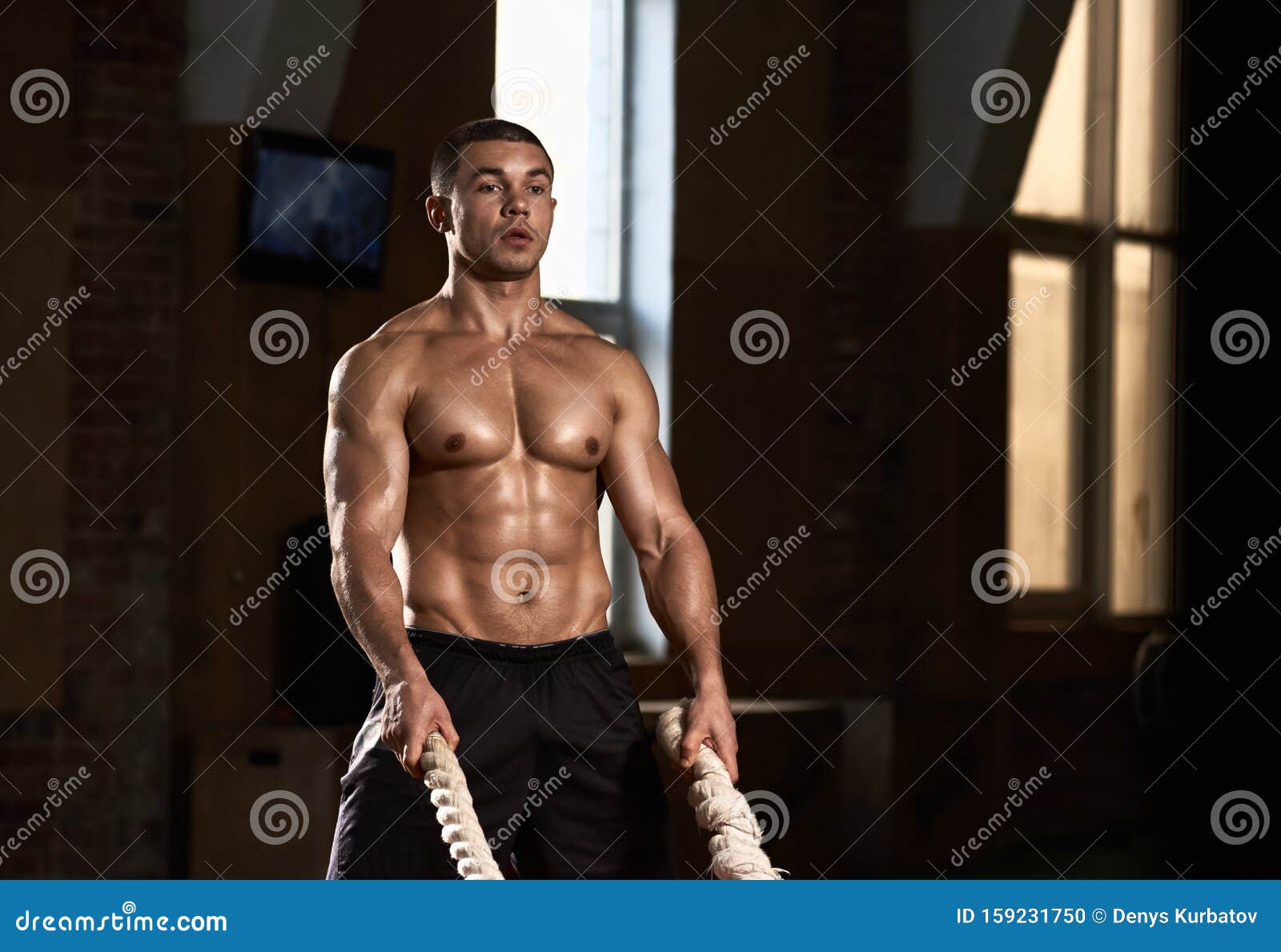 Bodybuilder with Battle Rope Stock Photo - Image of exercise, biceps ...